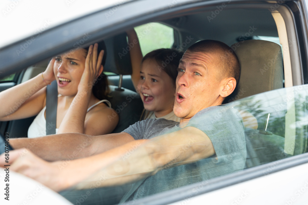 Shocked family frightened of accident or collision. Man driving car ...