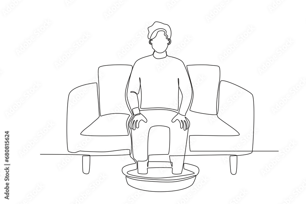 Single continuous line drawing healthcare a man is soaking his feet in ...
