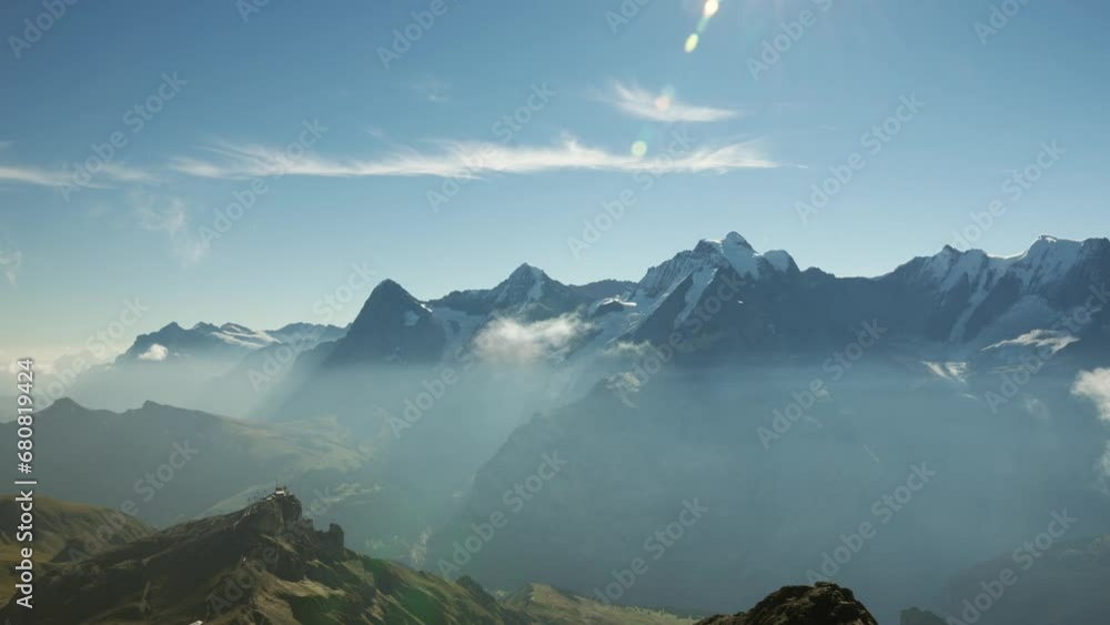 The glacial stream with the Breithorn and Wetterlucke peaks in the ...