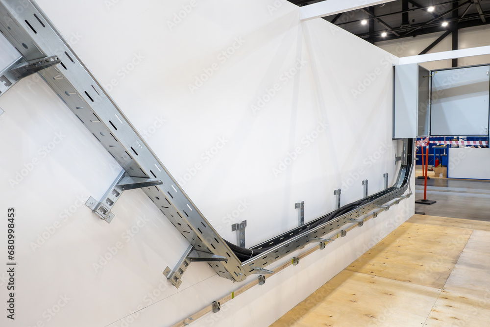 Electrical communications. Steel cable channel on wall. Room with power ...