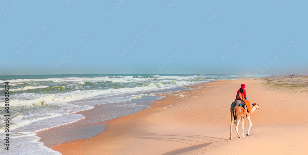 Sahara desert with Atlantic ocean meets - A woman in a red turban ...