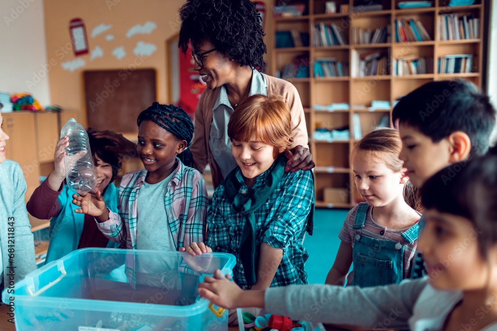 Children learning how to recycle plastic in elementary classroom Stock ...