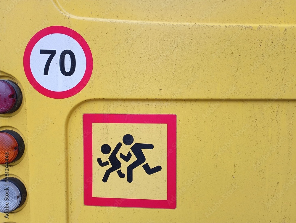 On the yellow body at the back of the bus for the transportation of ...