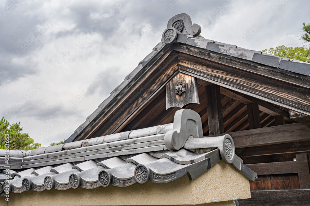 Clay tiles used in Japanese roofs along the Mitsudomoe symbol ...