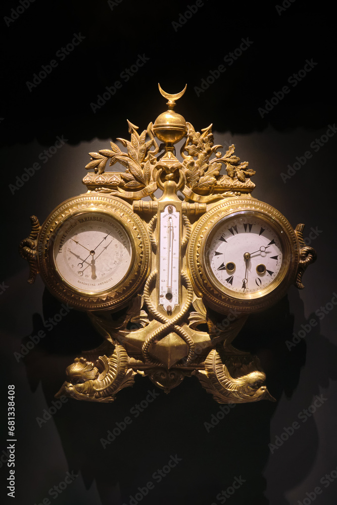 Close-up a ancient marine mercurial barometer, thermometer and clock on ...