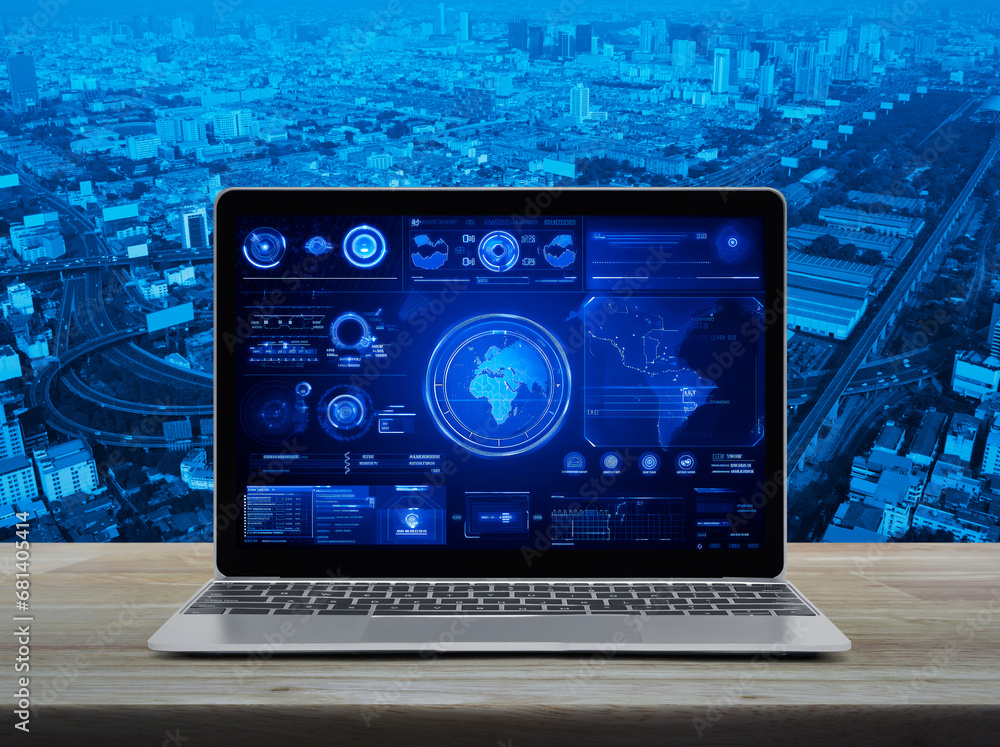 Laptop computer with digital world map with data charts and stats ...