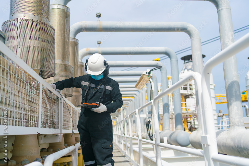 Non-destructive testing technicians are checking the thickness of pipes ...