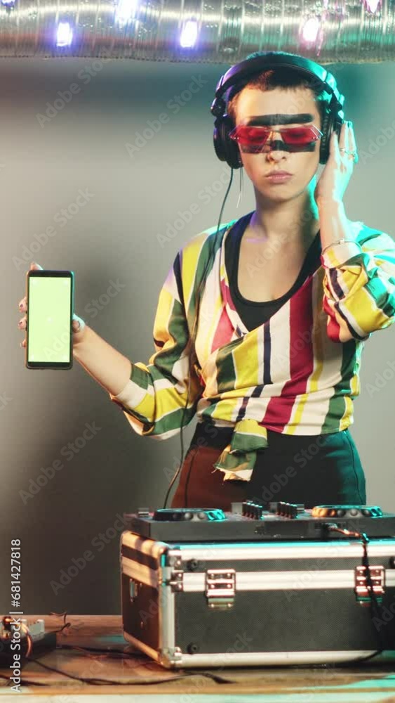 Vertical Video DJ artist shows greenscreen template while she uses ...