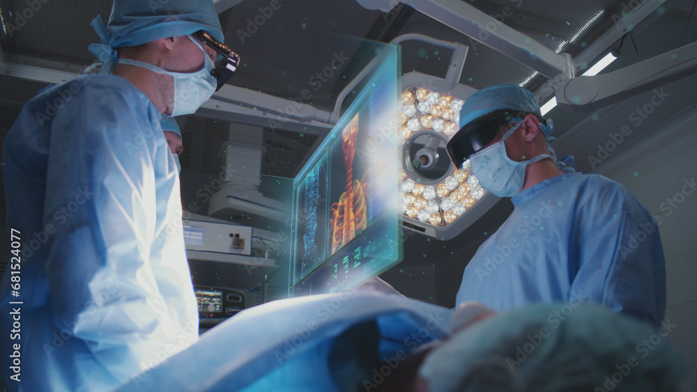 Surgeons in AR headsets operate patient in modern hospital. Doctors ...