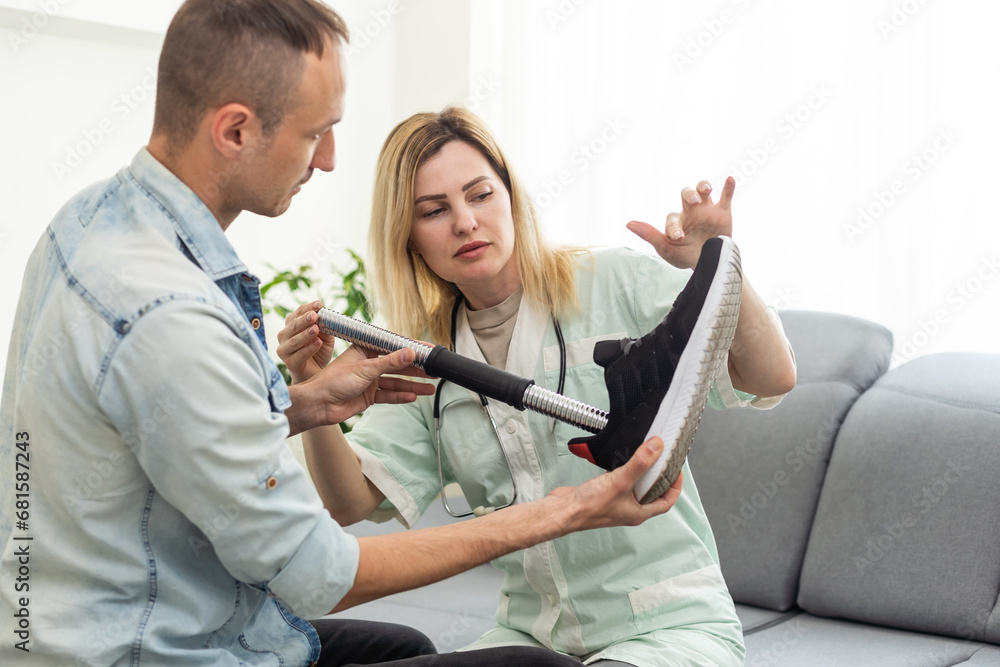 Modern Hospital Physical Therapy: Doctor Uses Tablet Computer, Helps ...