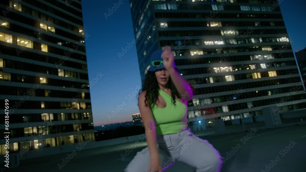 Active beautiful mixed race woman clubbing at disco party on rooftop ...