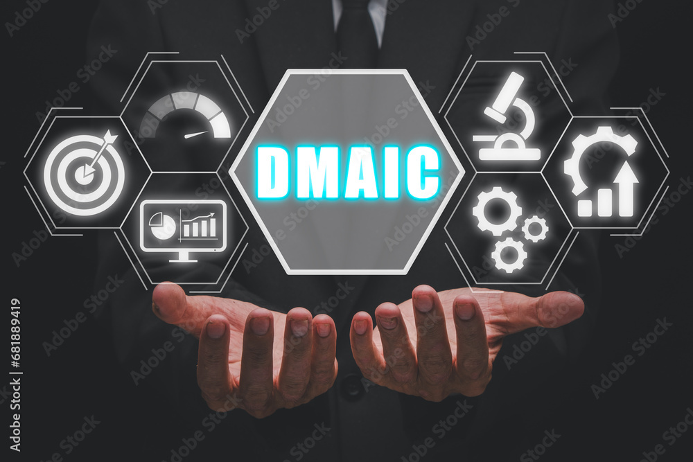 DMAIC is an acronym for Define, Measure, Analyze, Improve and Control concept, Businessman hand ...