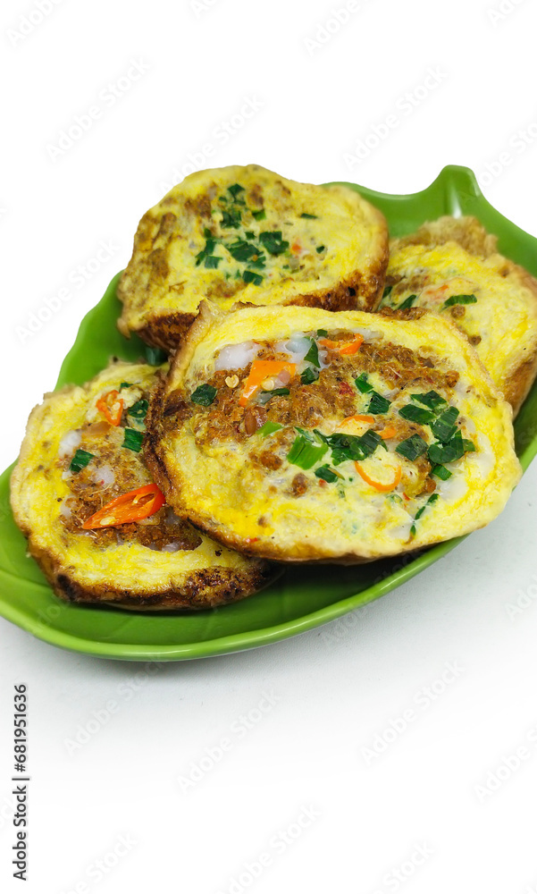 street food from Indonesia, Serabi egg. Serabi is shaped like a pancake ...