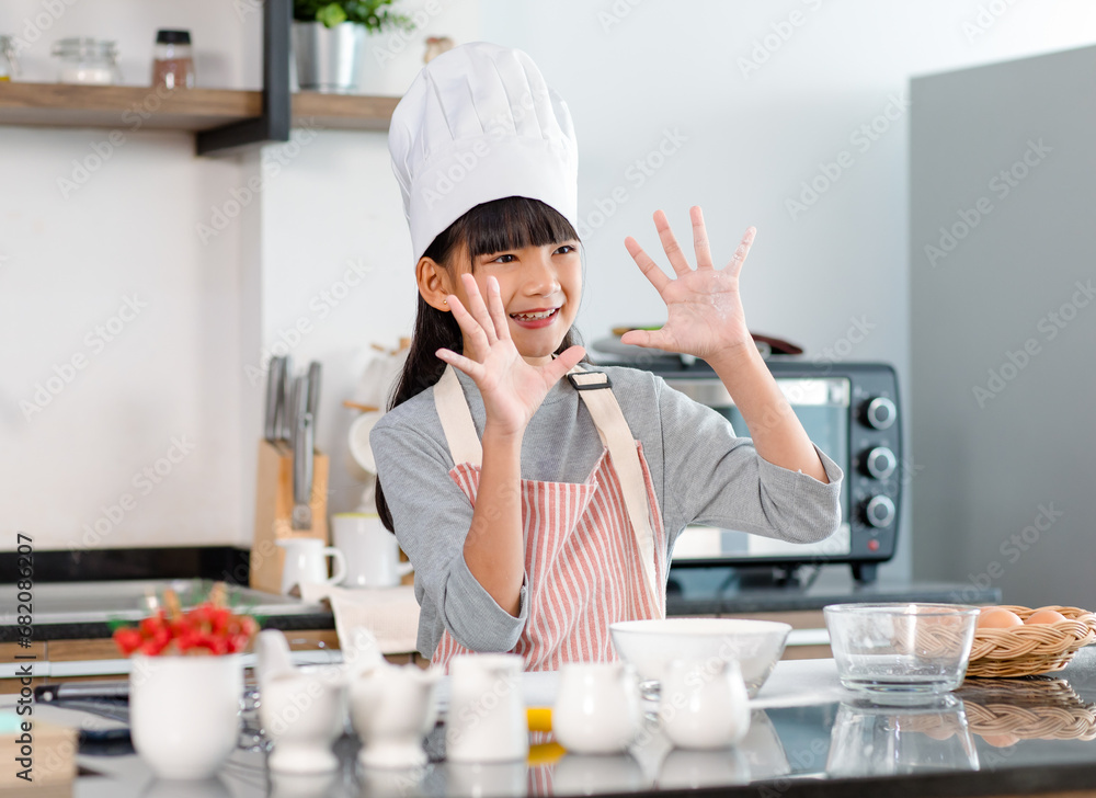 Asian beautiful little girl baker bakery pastry chef wears white tall ...