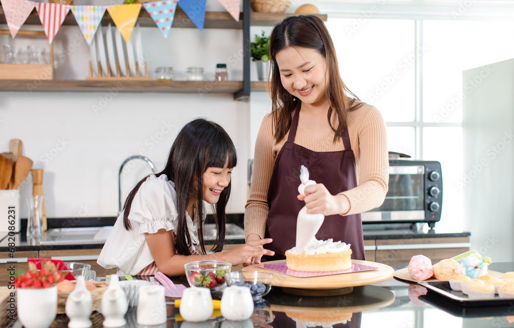 Asian beautiful female baker pastry chef mother wears apron standing ...