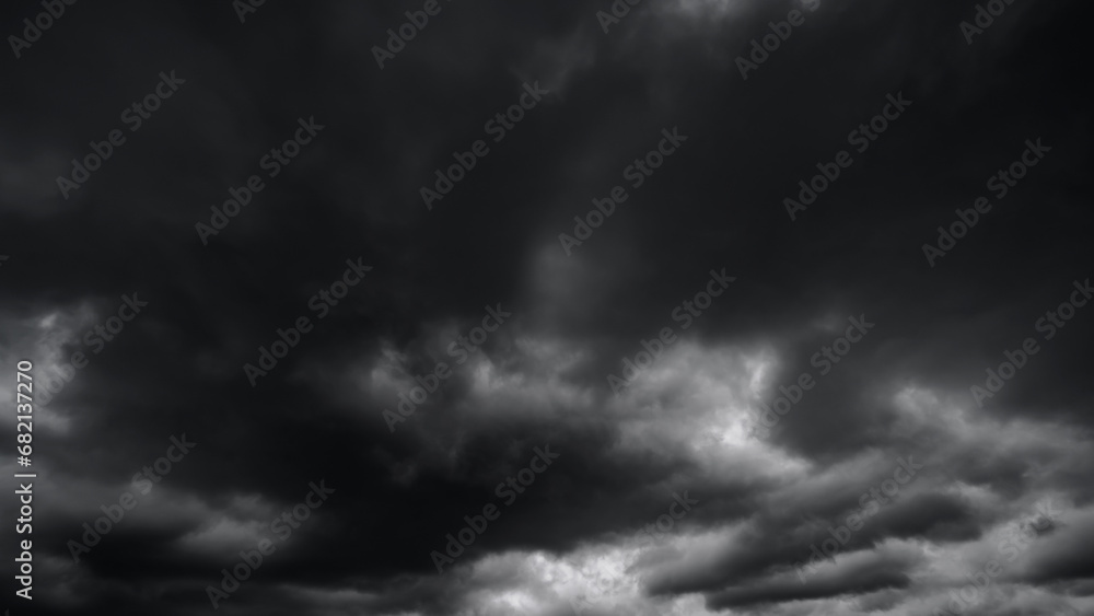 dark dramatic sky with black stormy clouds before rain or snow as ...