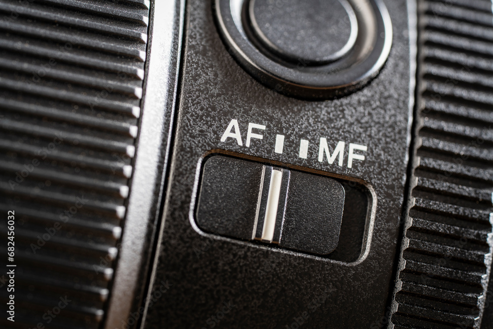 Closeup of the auto or mannual focus button on the new camera lens. Af ...