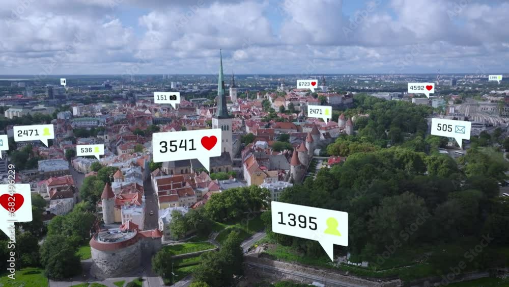 Aerial slide and pan footage of historic city center with tourist ...