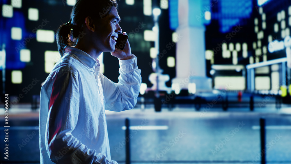 Asian man talking over the phone with wife using cellphone to feel less ...