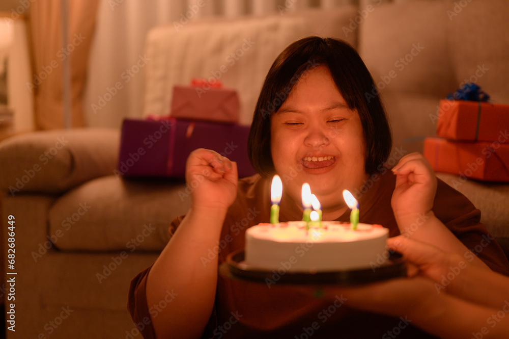 Foto de Happy birthday to young Asian woman with Down syndrome and her ...