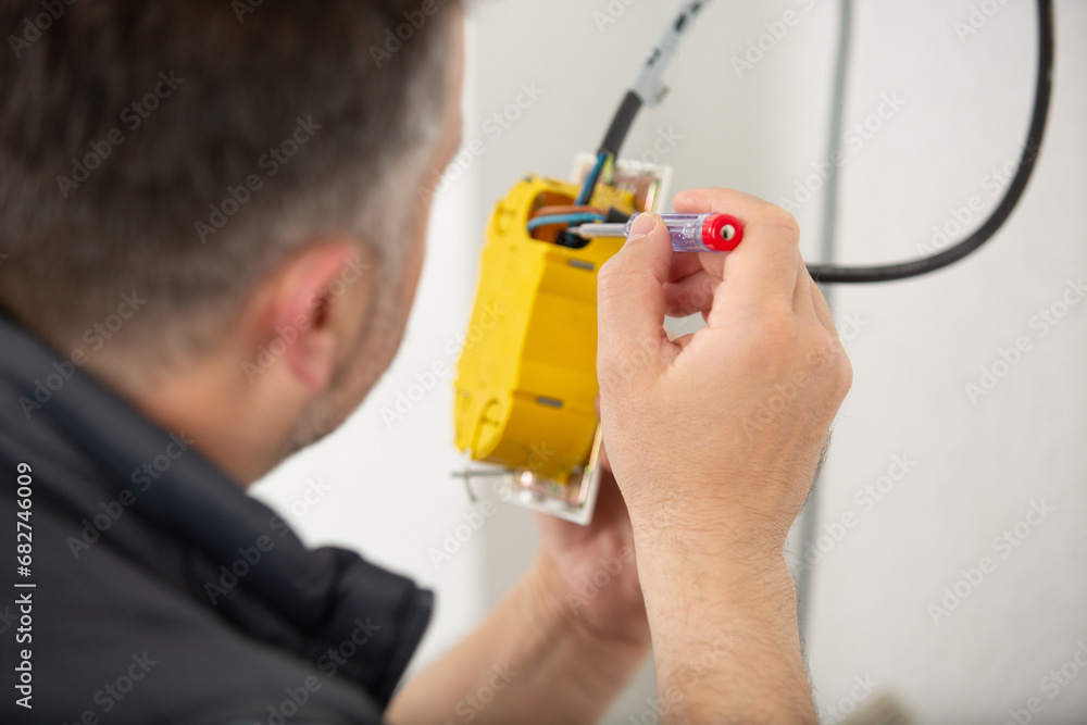 man using screwdriver in an electrical junction box Stock Photo | Adobe ...