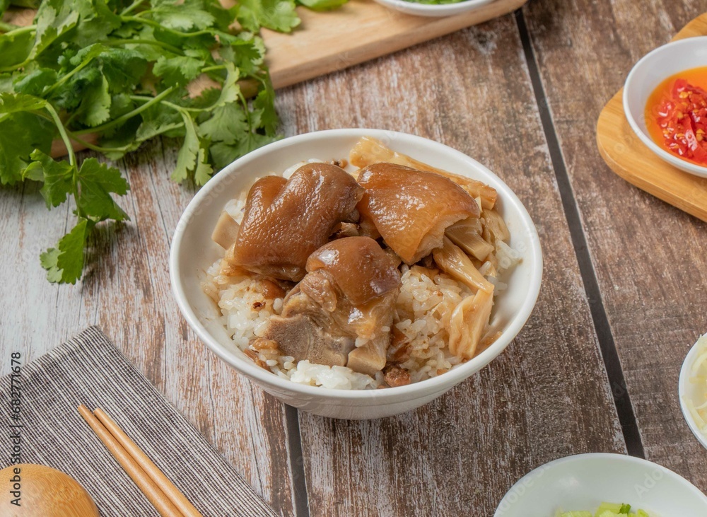 Pig feet rice pork meat with chilli sauce, noodles, spoon and ...