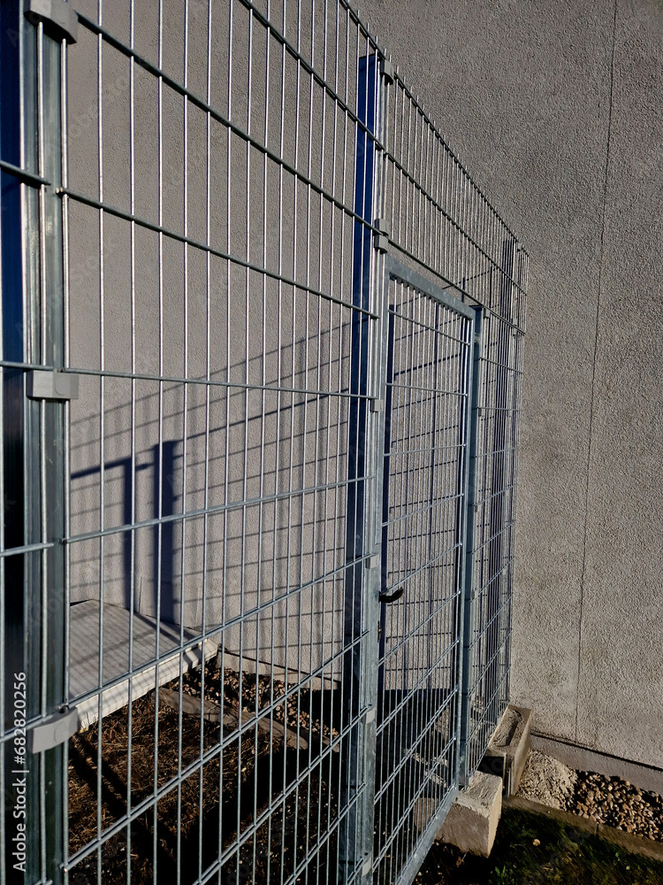 strong galvanized welded mesh fencing is used around industrial halls ...