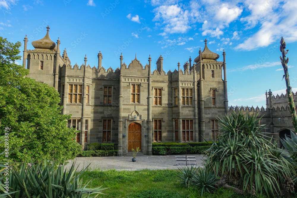 Vorontsov Palace in Crimea in summer. Ancient walls with many columns ...