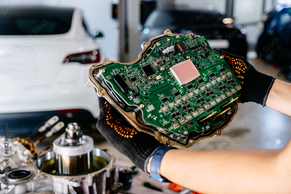 Electronic Control Unit (ECU) of modern electric car in male auto ...