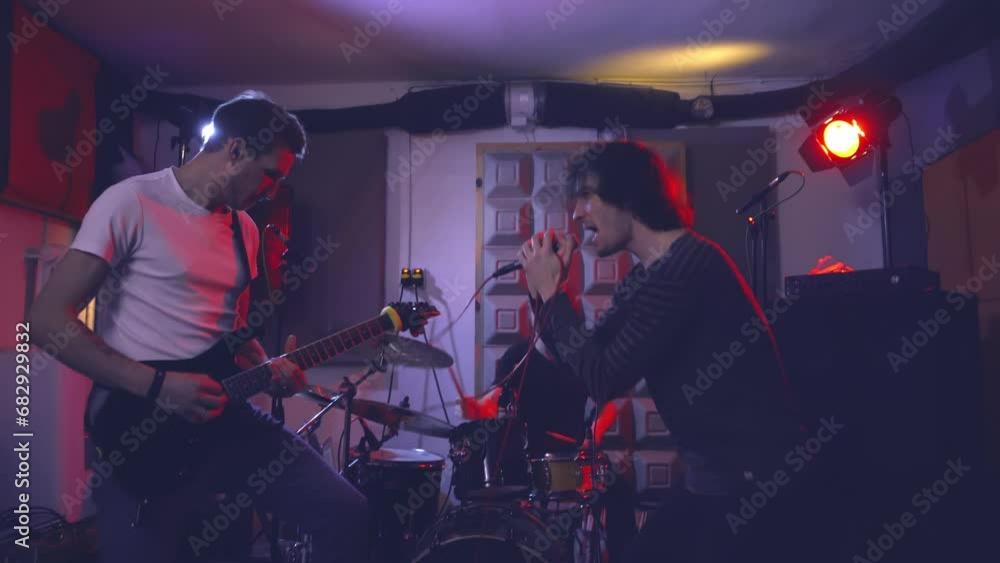 A group of musician friends, a vocalist, a guitarist and a drummer ...