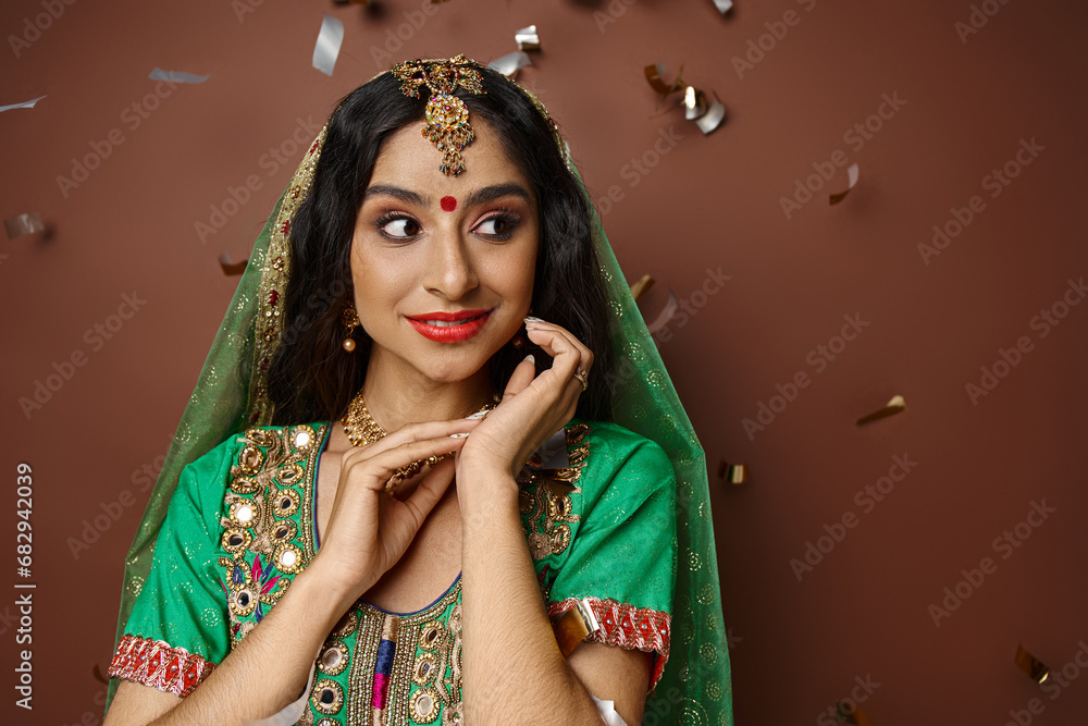 cheerful indian woman in traditional attire with bindi dot on forehead ...