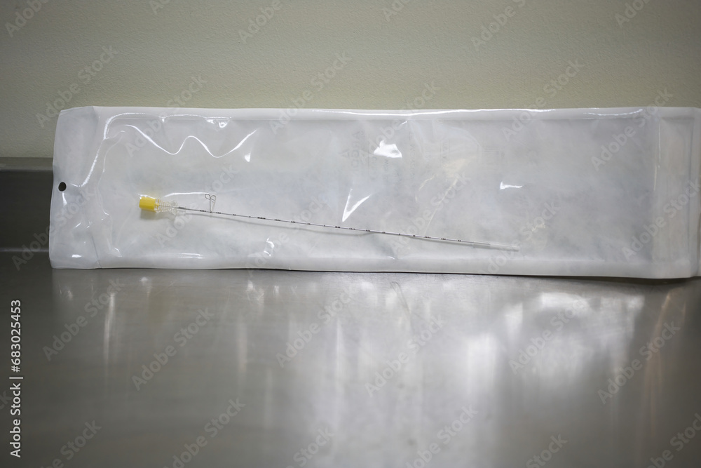 Yellow long spinal needle used to enter the disc and treat herniated ...