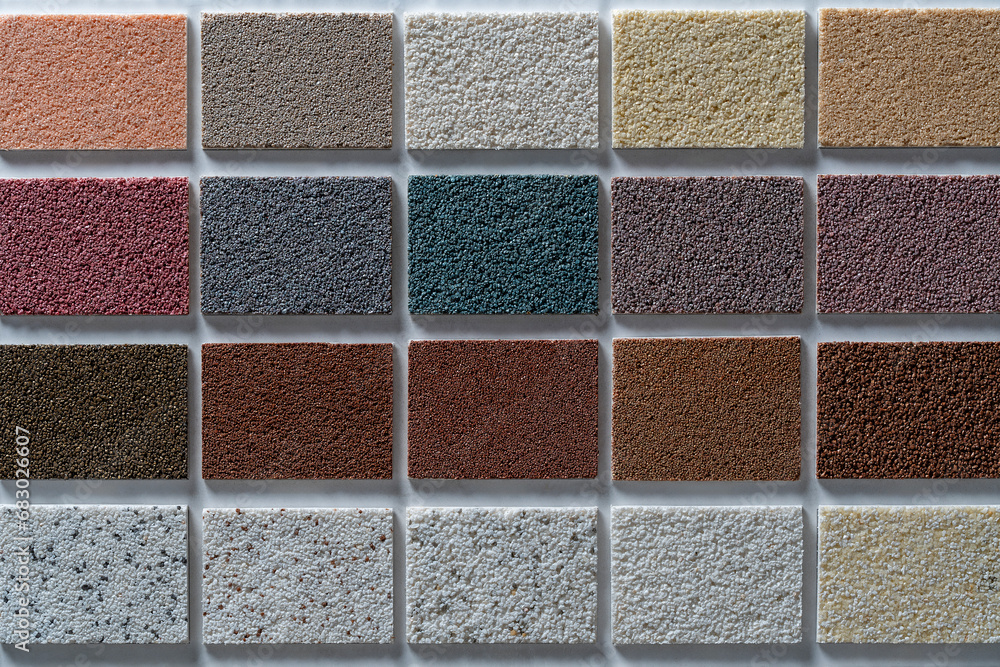 Samples of multi colored plaster for the decoration of the facade and ...