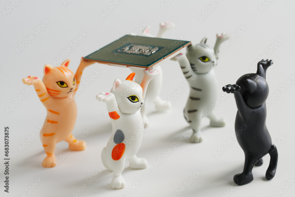 Funny toy kittens have raised a modern powerful computer processor ...