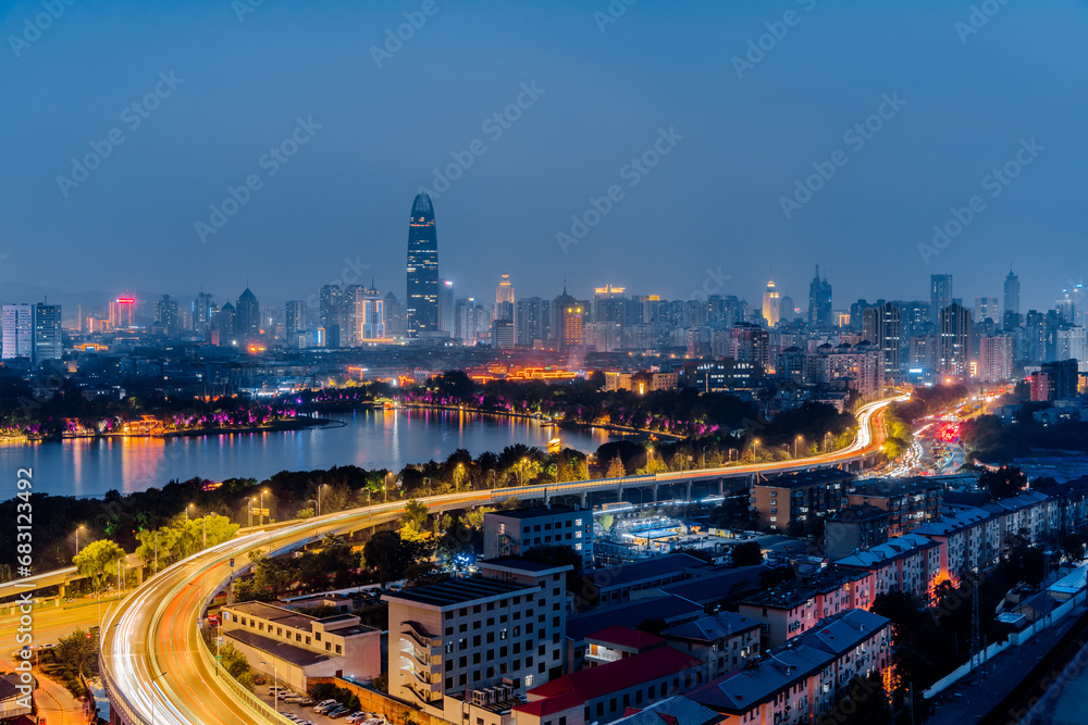 Night view of Daming Lake and city viaduct skyline in Jinan, Shandong ...