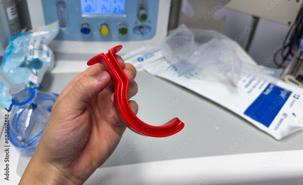 medical professional using airway equipment, mask, laryngoscope, and ...