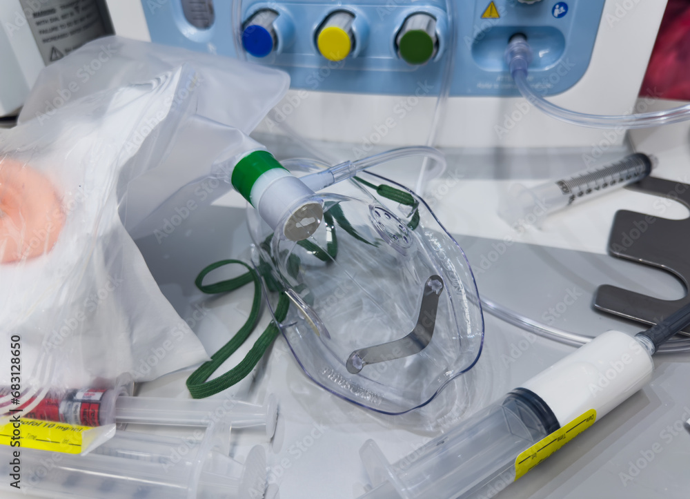 medical professional using airway equipment, mask, laryngoscope, and ...