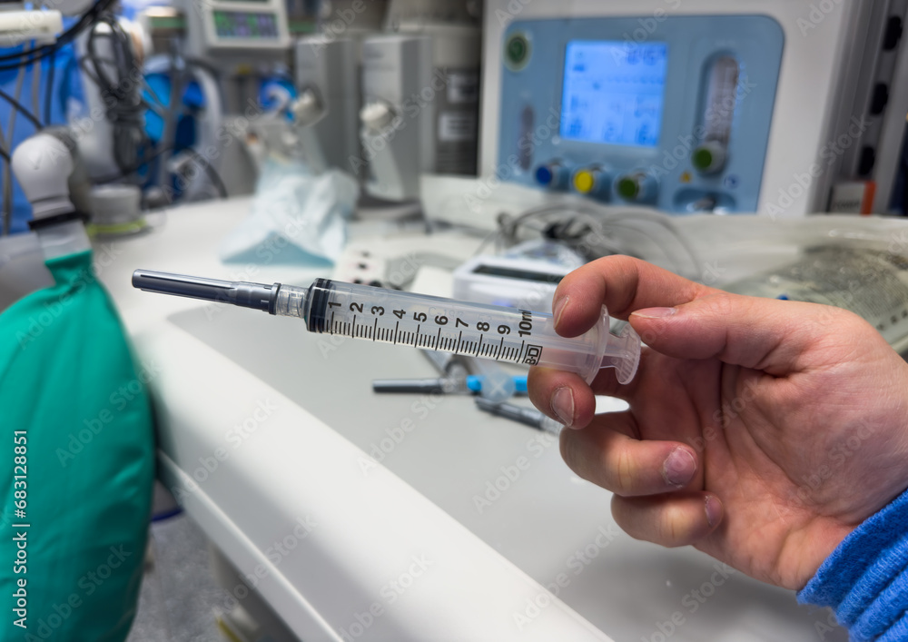 Clinical setting with medications, syringes, and needles on a hospital ...