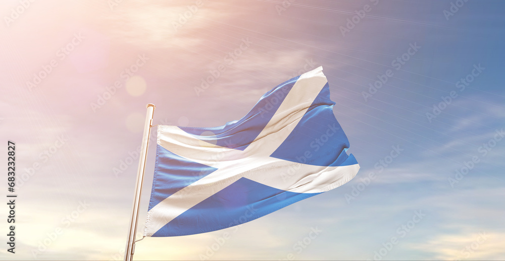 Scotland national flag waving in beautiful sky. The symbol of the state ...