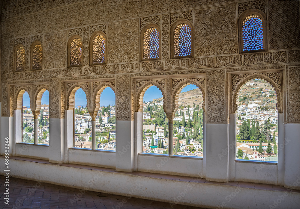 Through moorish windows, view of The Albaicín district in Granada ...