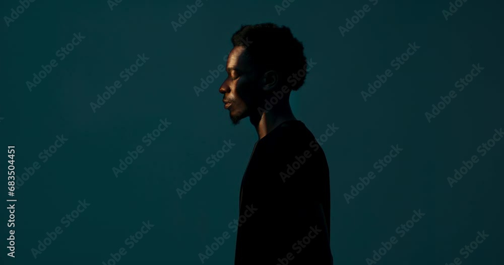 Profile of handsome attractive dark skinned male standing straight ...