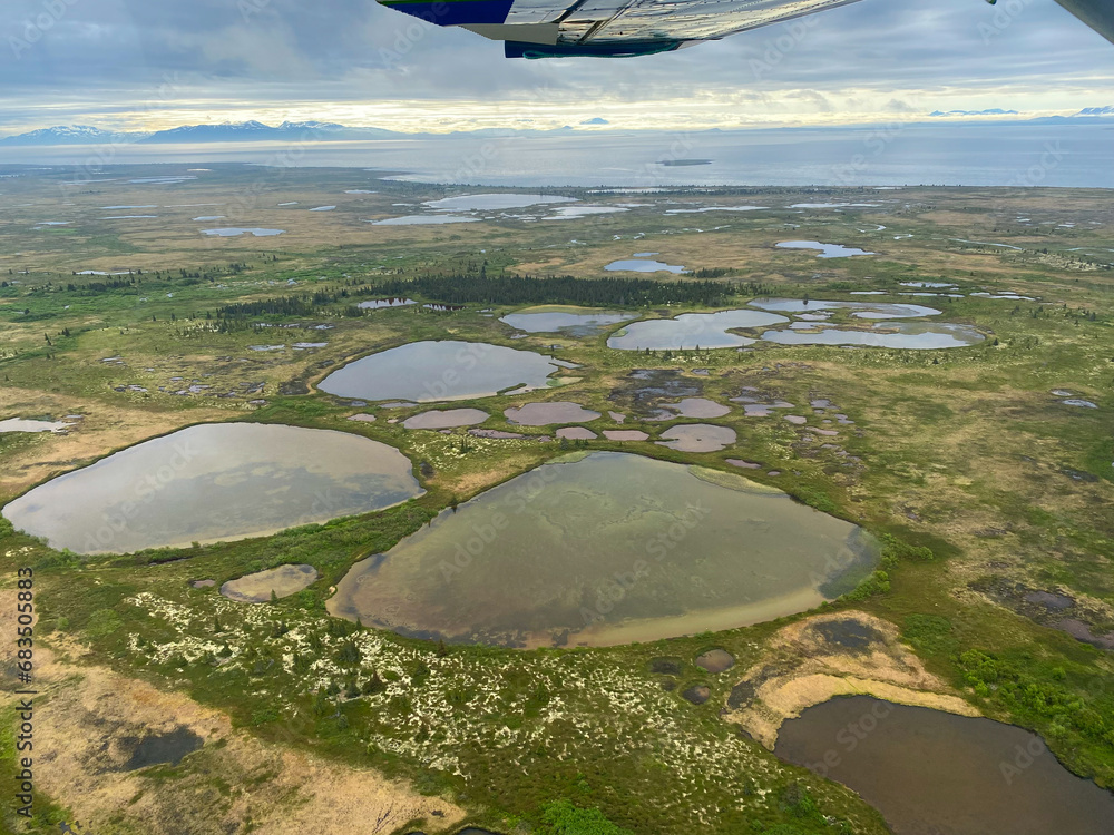 Aerial view of small ponds and shore line of Six Mile Lake, between ...
