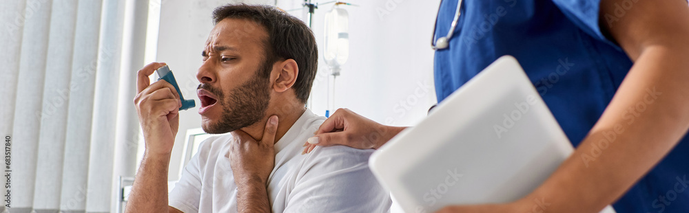 african american nurse helping her indian patient with asthma inhaler ...