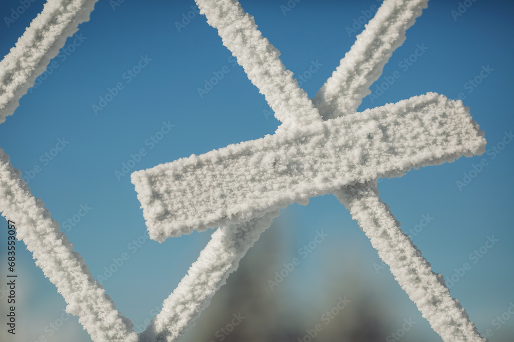 Frozen grate in winter. lattice with frost on the background of the ...