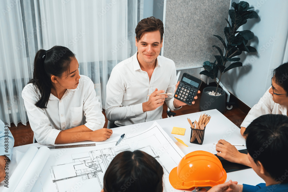 Diverse group of civil engineer and client working together on ...