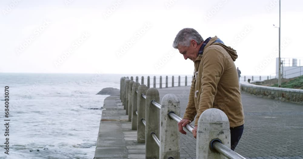 Sad, man and thinking at the beach with depression, stress and grief ...