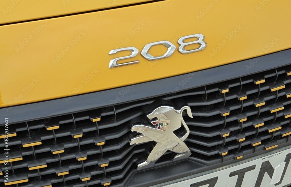 Lettering and modern Peugeot Logo of an actual e-208 car Stock Photo ...