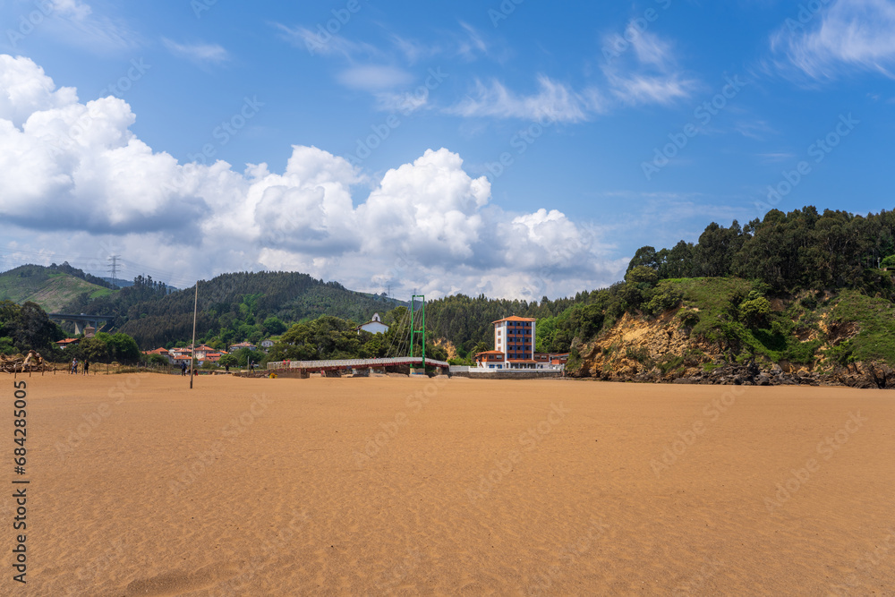 Puente Pobeña bridge over the river Barbadun seen from Playa La Arena ...