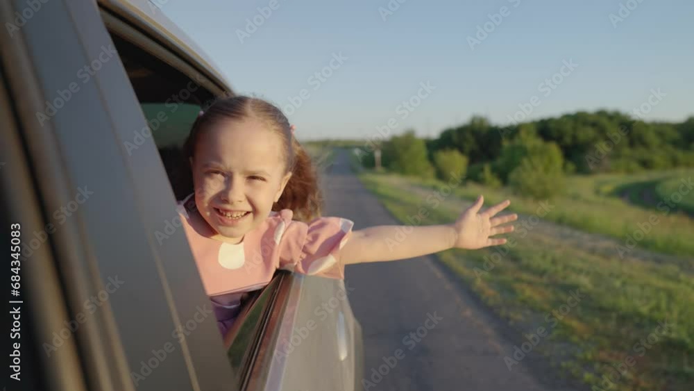 Child, stretching his hand out of car window, laughs, kid emotions ...