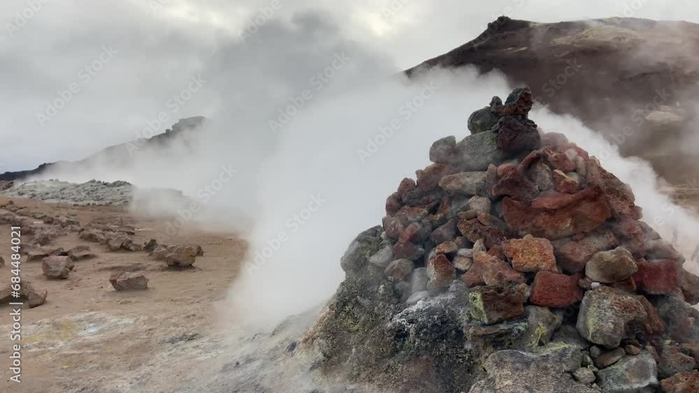 Pyramid of volcanic rocks emanating sulfur steam at Hverir volcanic ...